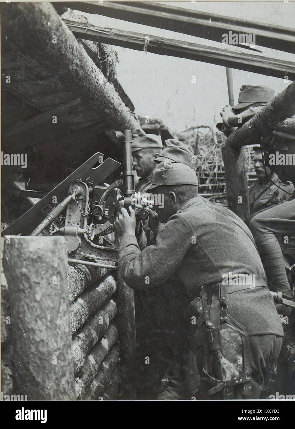 This image depicts a 37mm infantry gun positioned within the trench ...