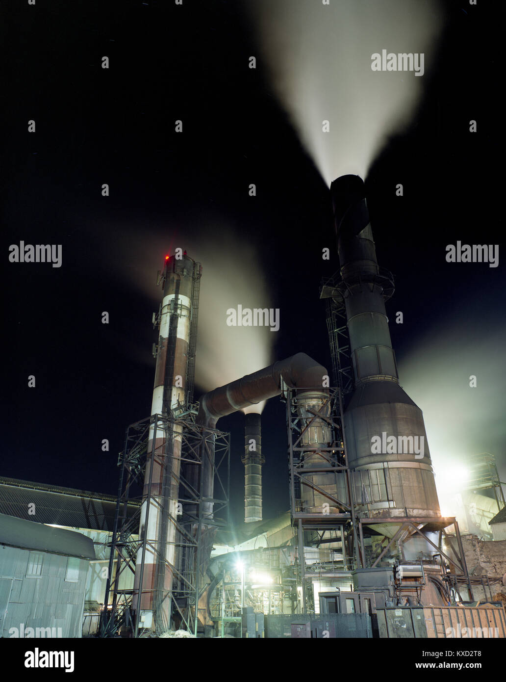 Low angle view of smoke emitting from industry against sky at night ...