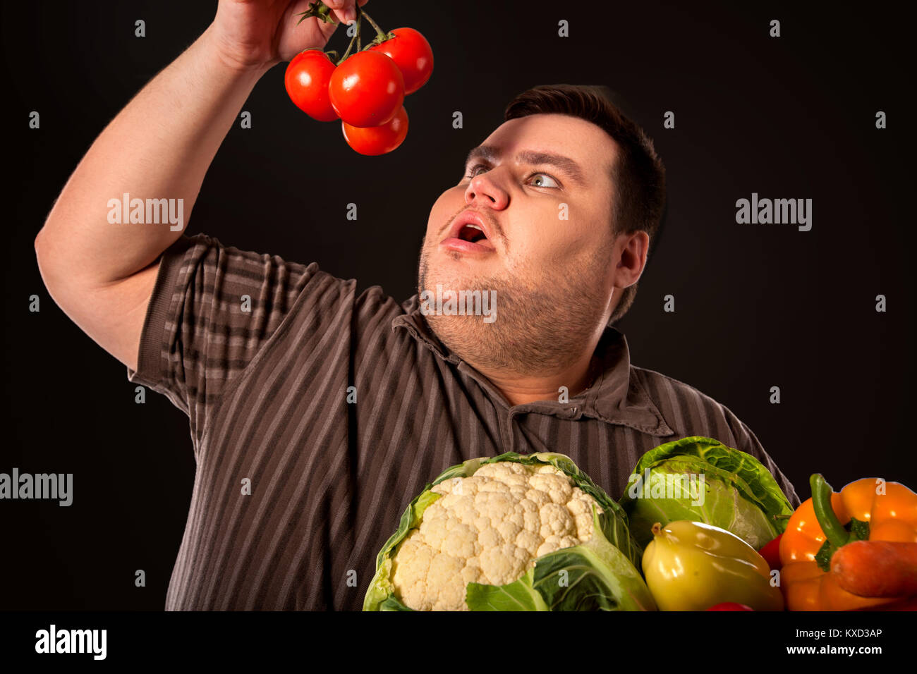 Diet fat man eating healthy food . Healthy breakfast with vegetables ...