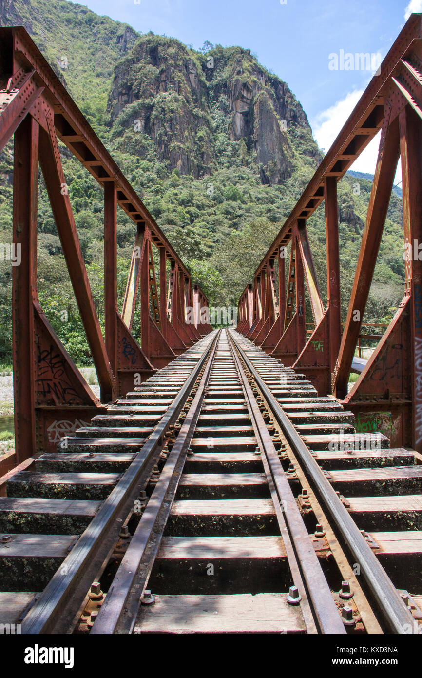 Railroad track on bridge against mountains Stock Photo - Alamy