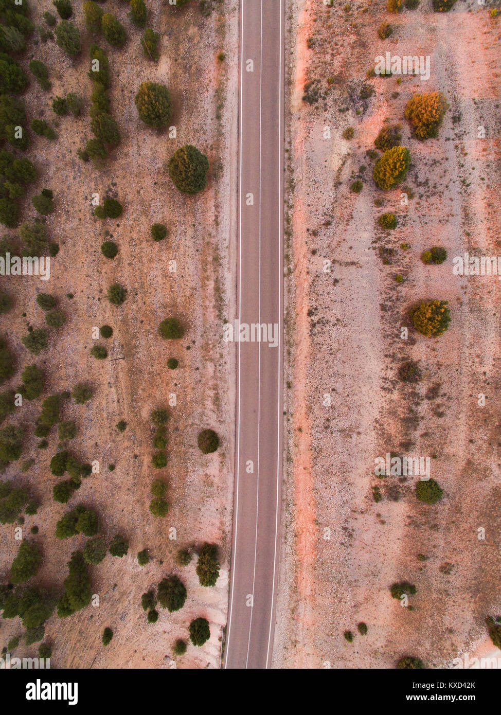 Overhead view of country road amidst desert Stock Photo - Alamy