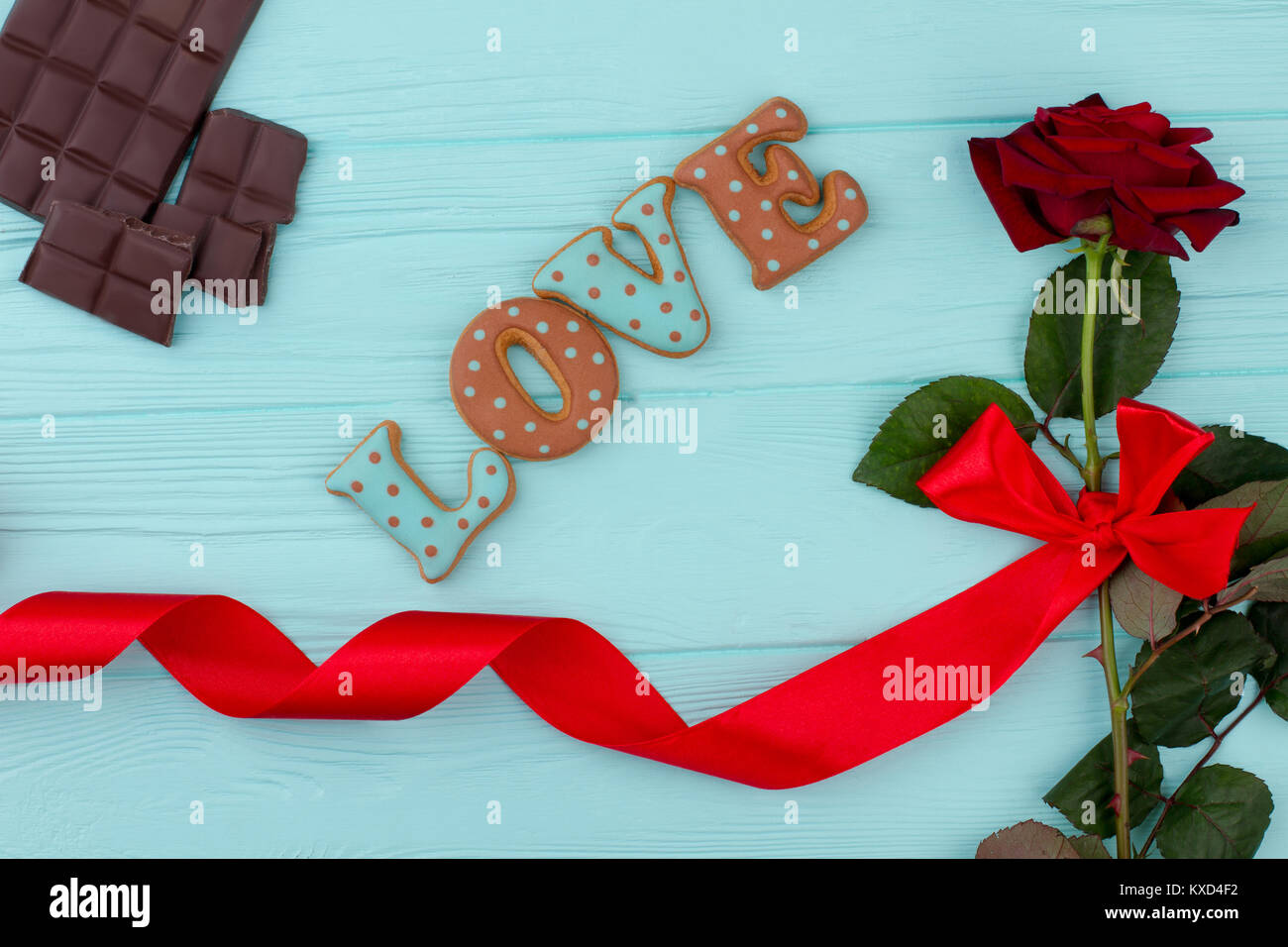 Word love from cookies and rose Stock Photo - Alamy