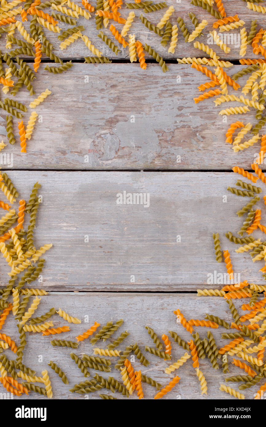 Frame from macaroni, wooden background Stock Photo - Alamy