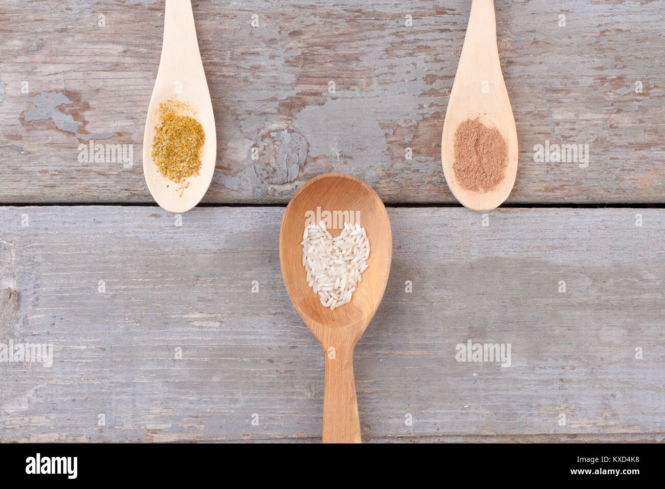 Wooden spoons with seasoning Stock Photo - Alamy