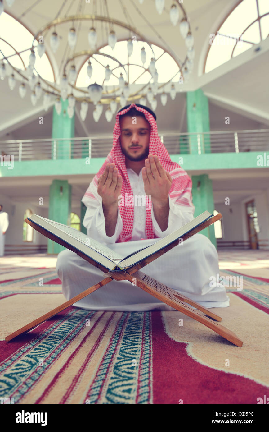Religious muslim man praying inside the mosque Stock Photo - Alamy