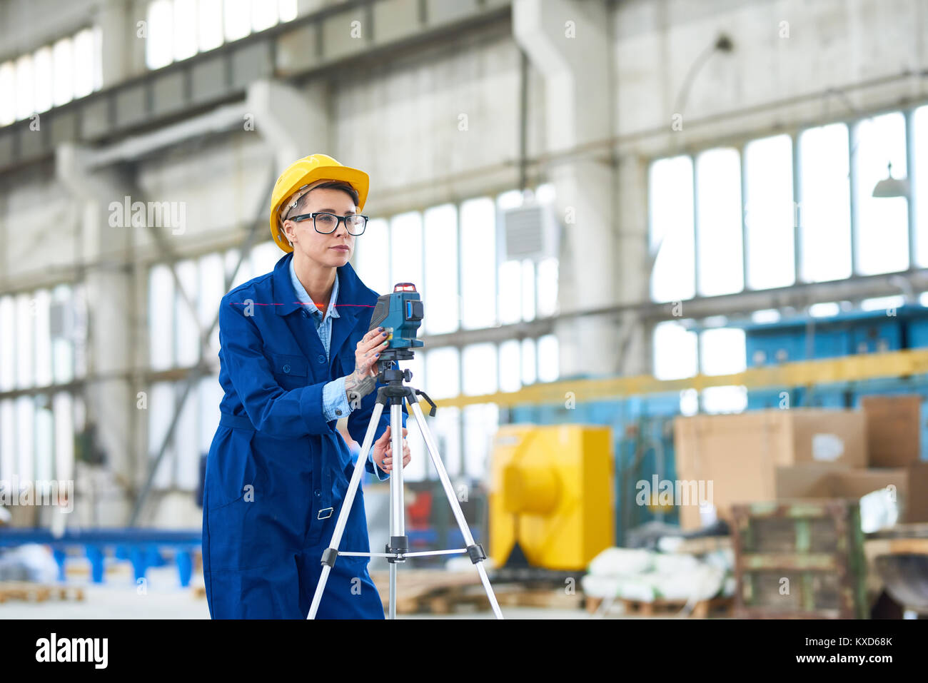 Female construction worker level hi-res stock photography and images ...
