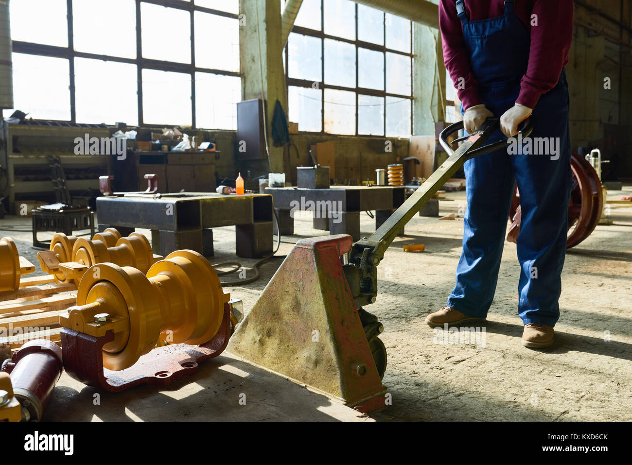 Using Pallet Jack in Warehouse Stock Photo - Alamy