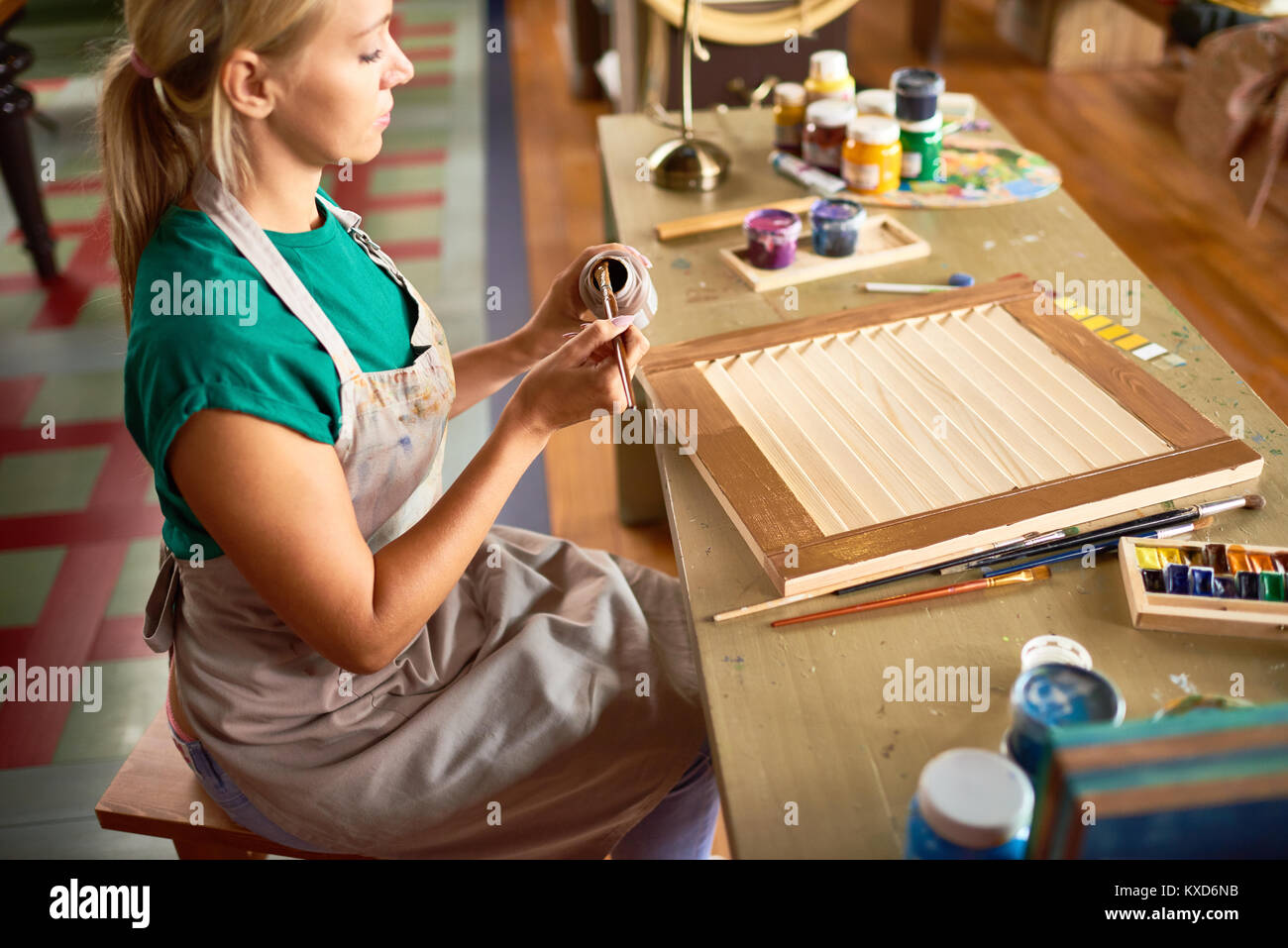 Young Female Artist Working in Studio Stock Photo - Alamy
