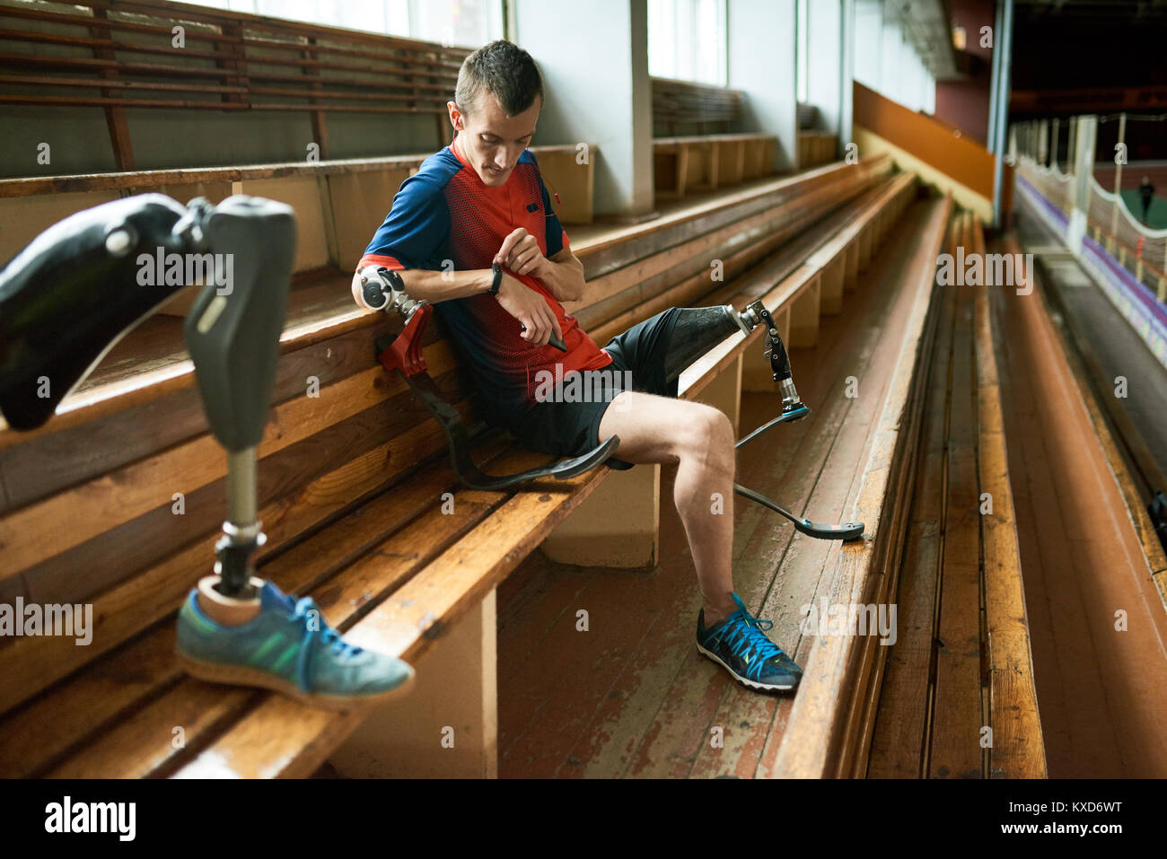 Disabled Sportsman Checking Activity Tracker Stock Photo - Alamy