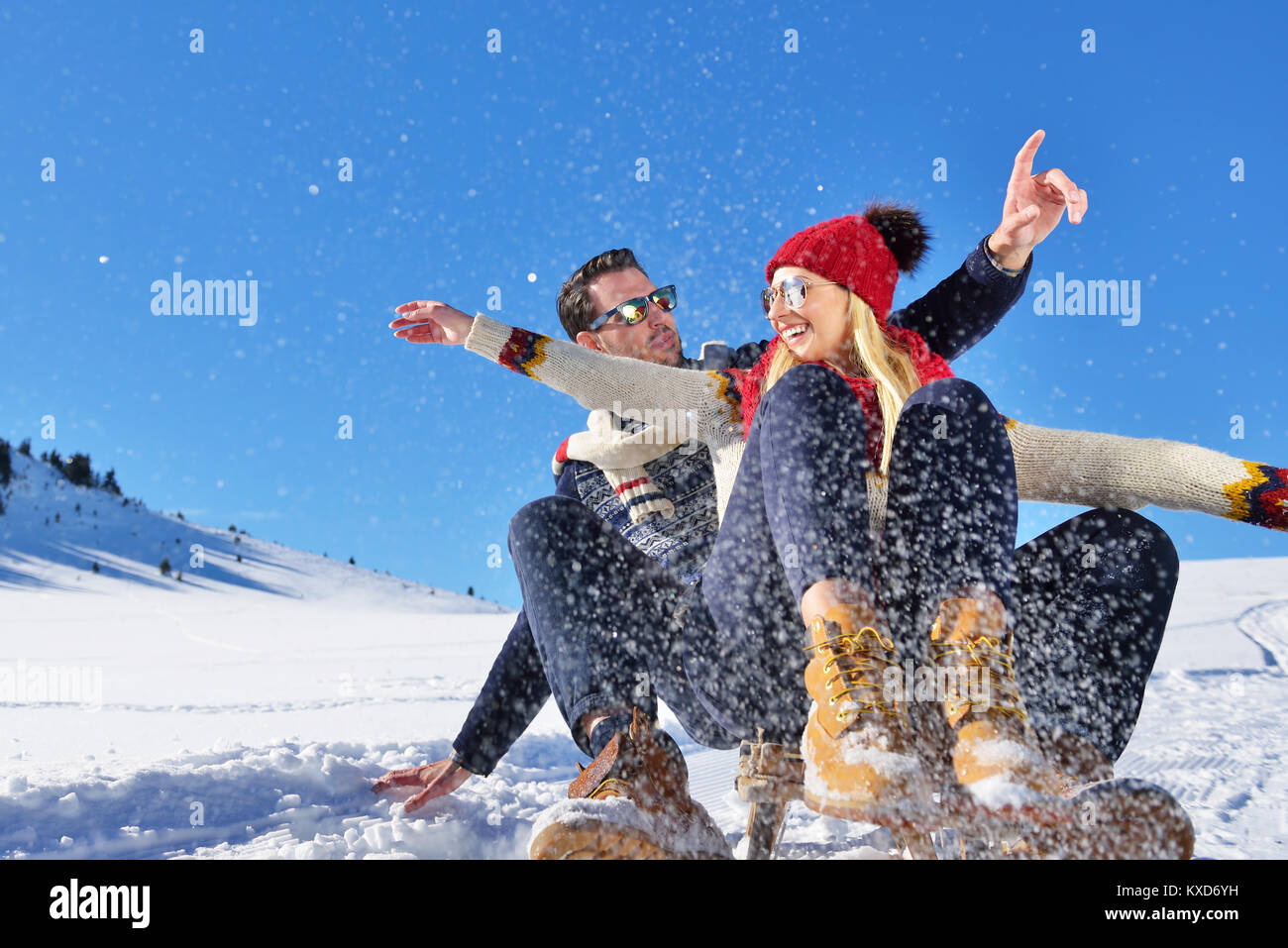 romantic winter scene, happy young couple having fun on fresh show on ...