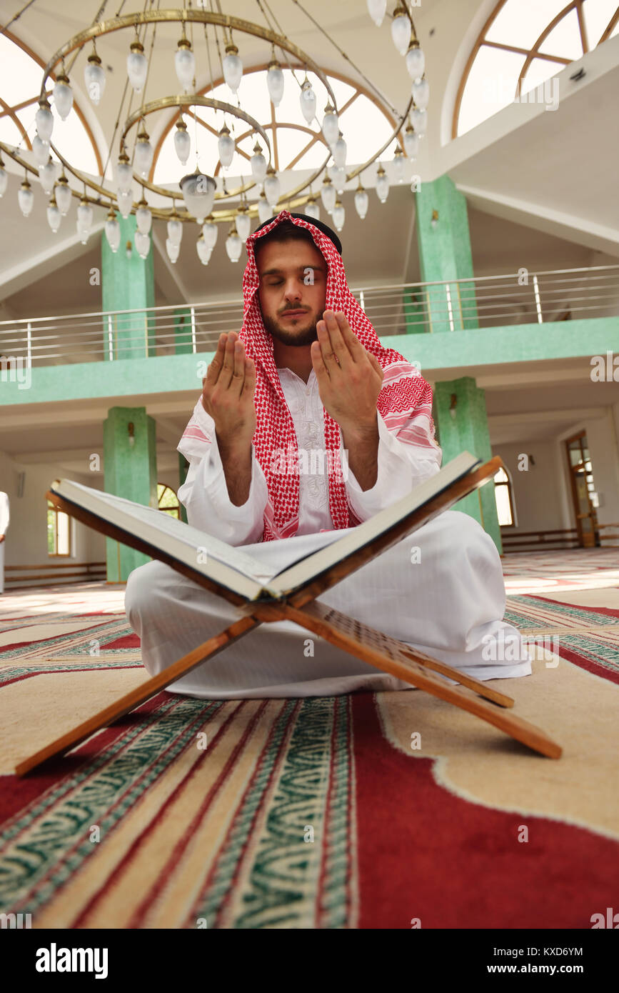Religious muslim man praying inside the mosque Stock Photo - Alamy