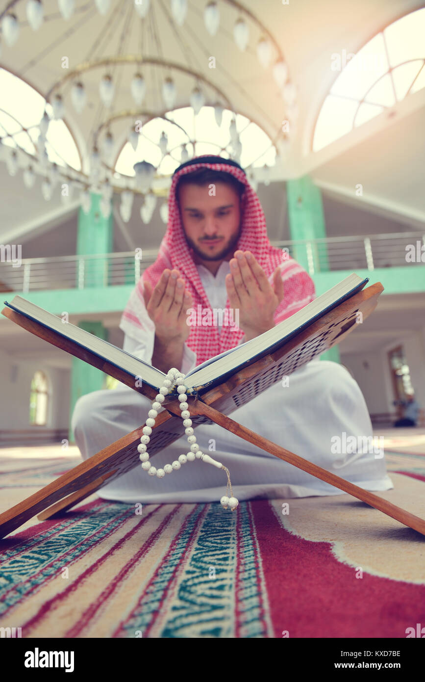 Religious muslim man praying inside the mosque Stock Photo - Alamy