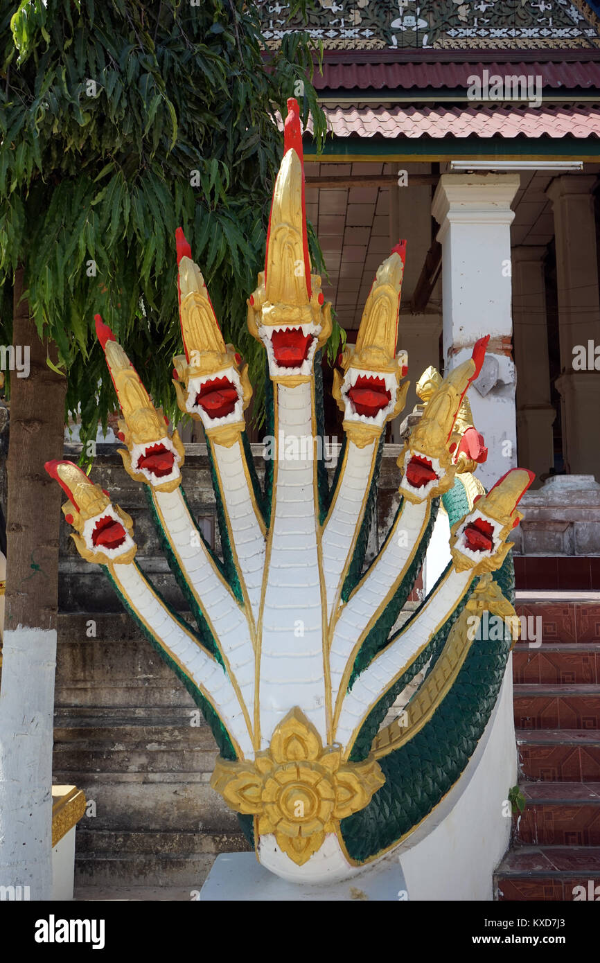 Big mythical Naga serpent in buddhist wat in Laos Stock Photo - Alamy