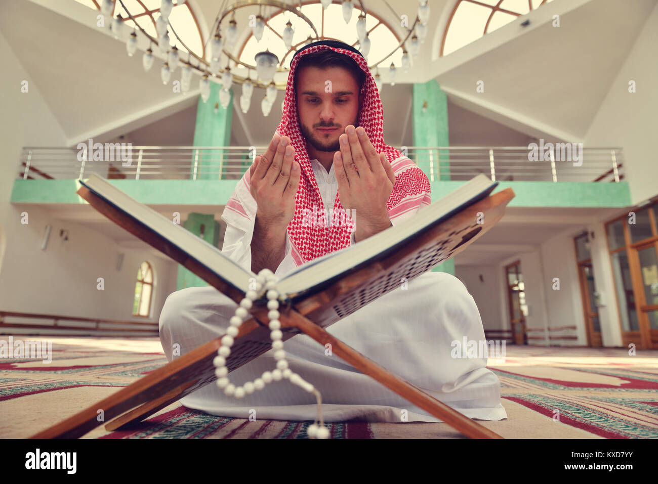 Religious muslim man praying inside the mosque Stock Photo - Alamy