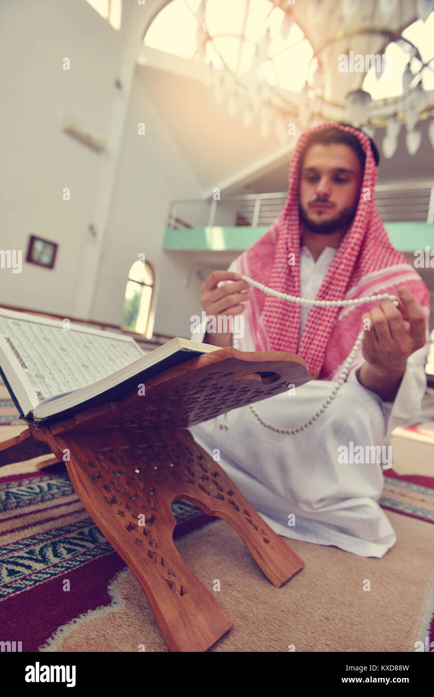 Religious muslim man praying inside the mosque Stock Photo - Alamy