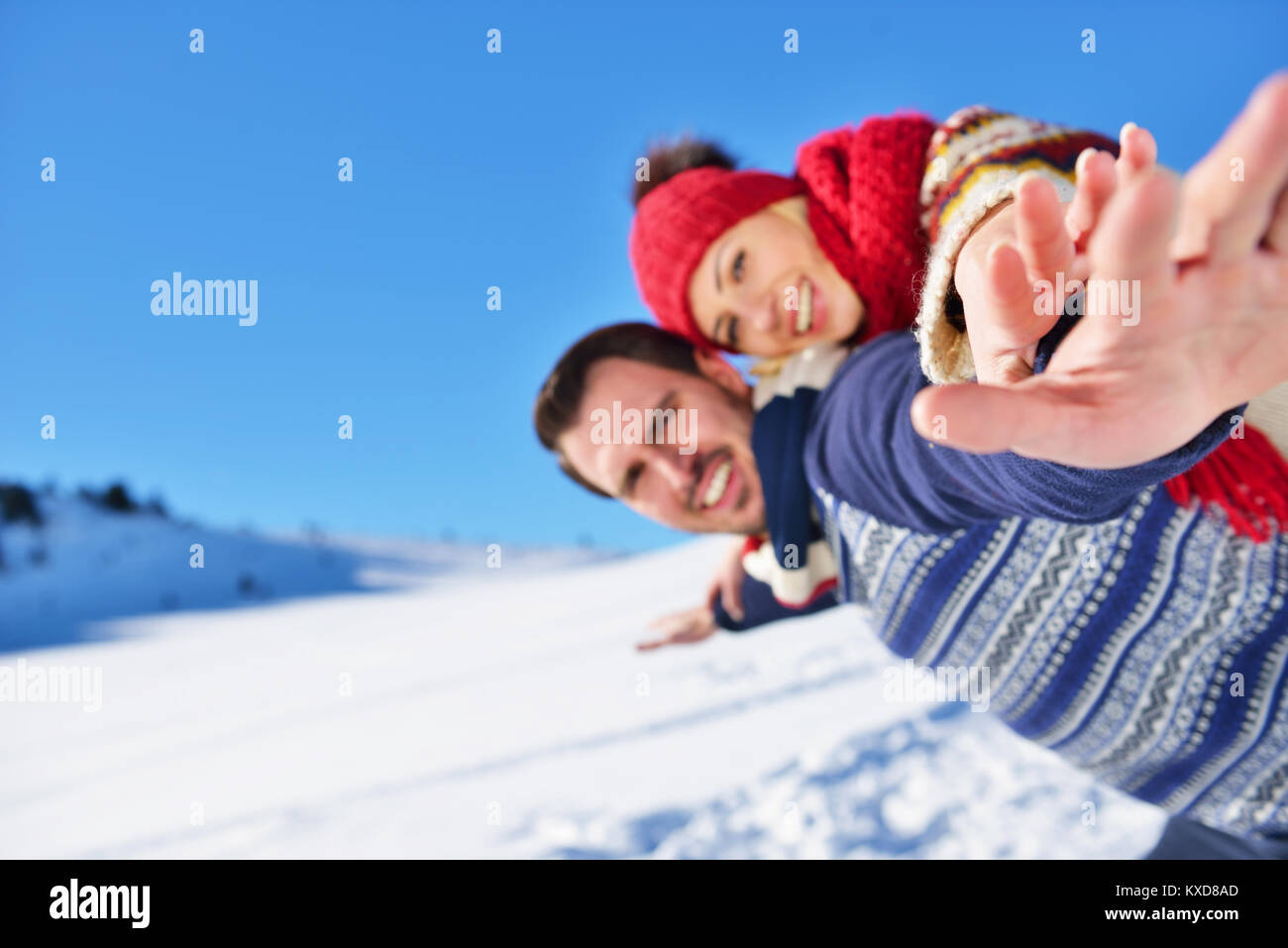 Loving couple playing together in snow outdoor Stock Photo - Alamy