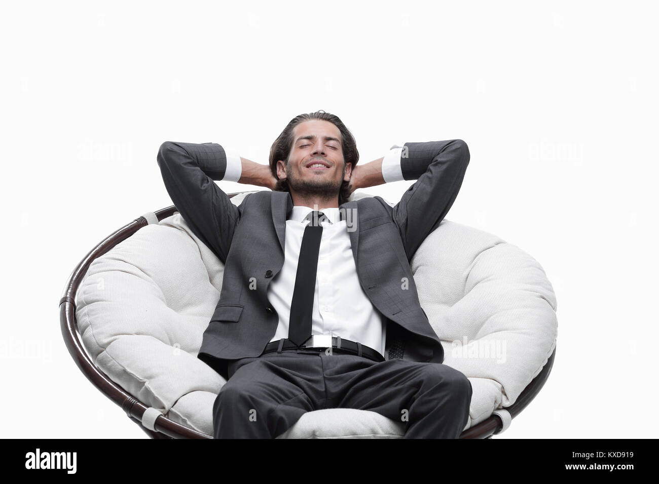 businessman resting in a comfortable chair Stock Photo - Alamy