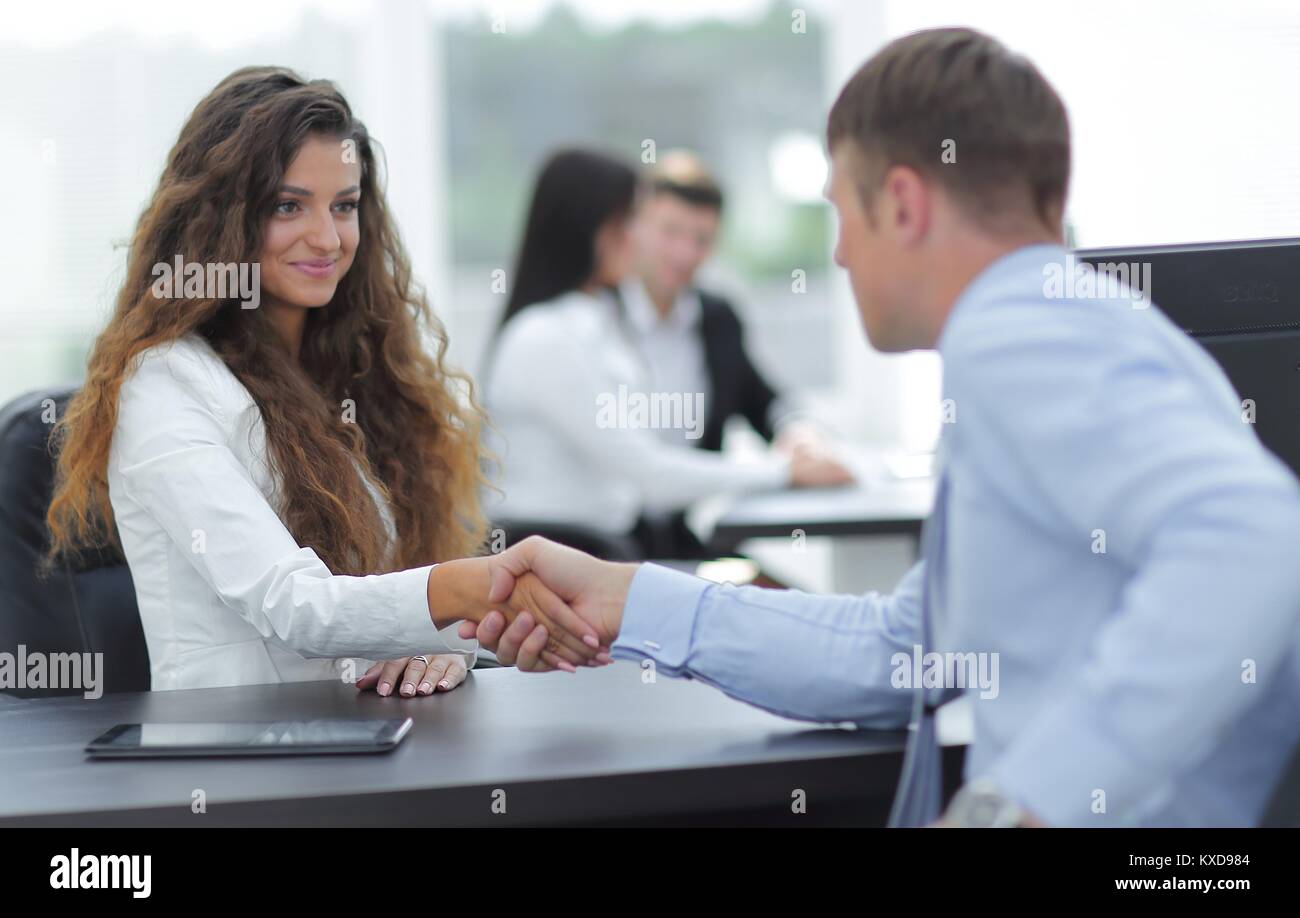 handshake Manager and the client in the office Stock Photo - Alamy