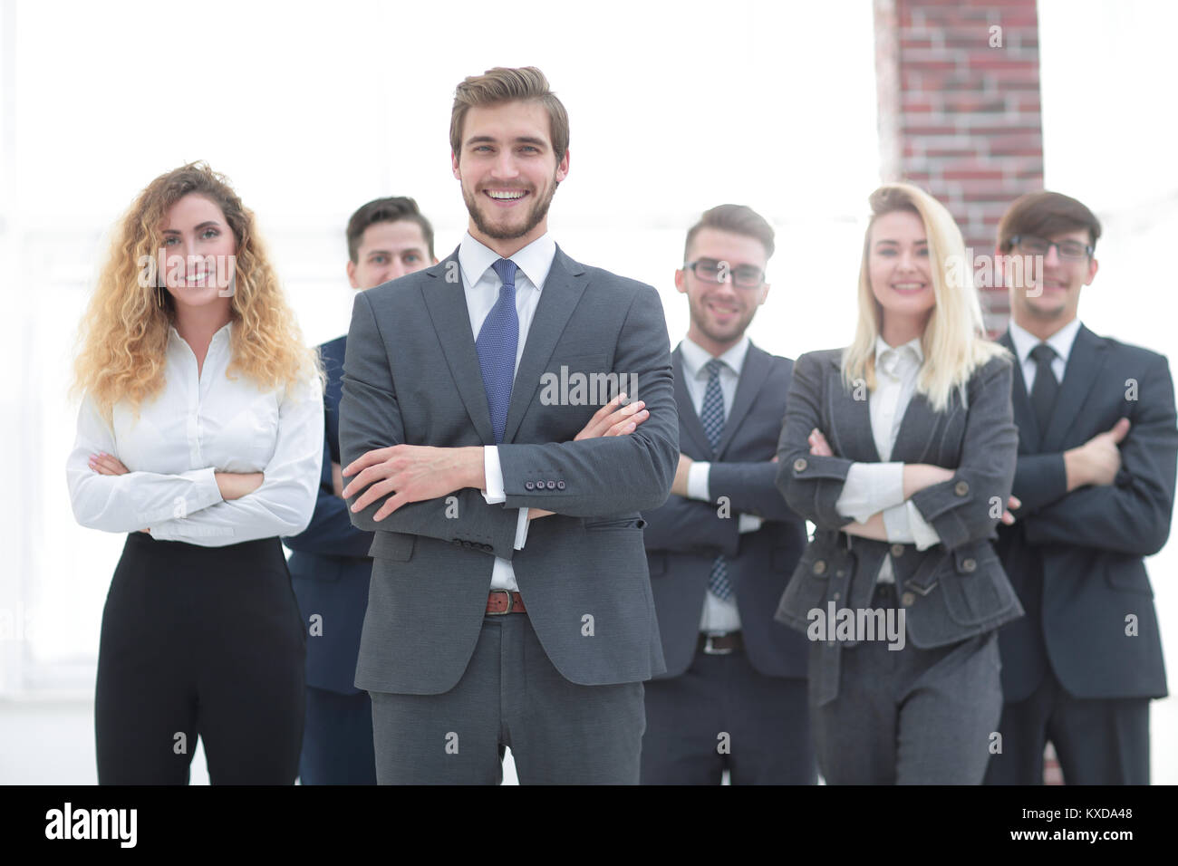 leader and a professional business team Stock Photo - Alamy
