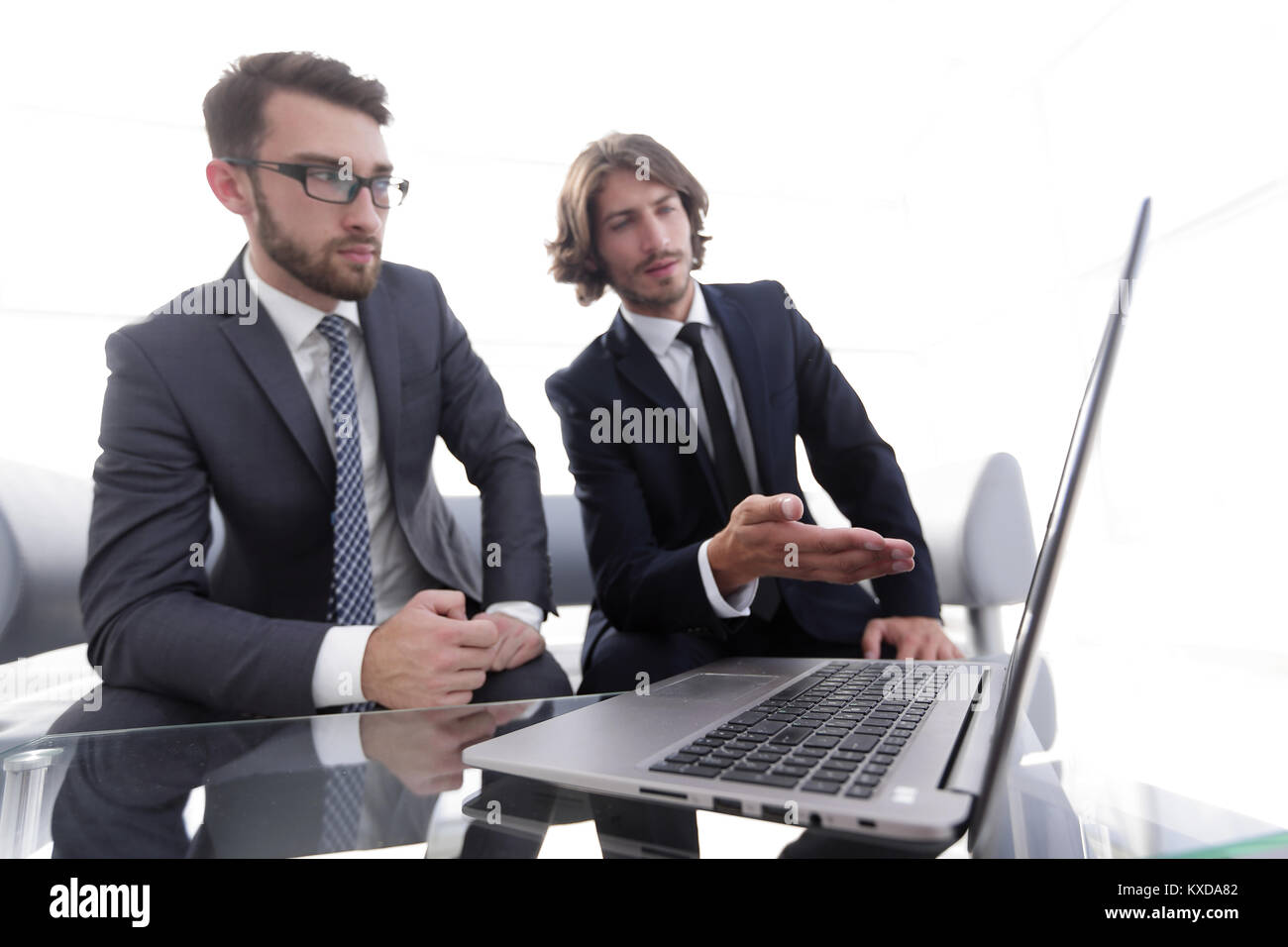 Two businessmen working on a project together Stock Photo - Alamy