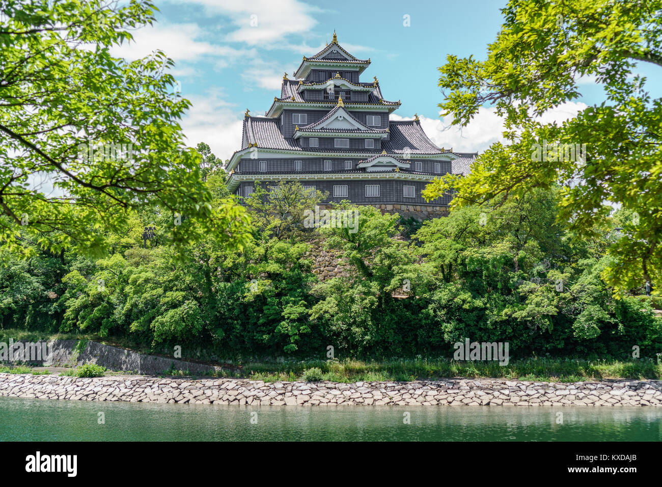 Okayama Castle facade and river with trees in Japan Stock Photo - Alamy