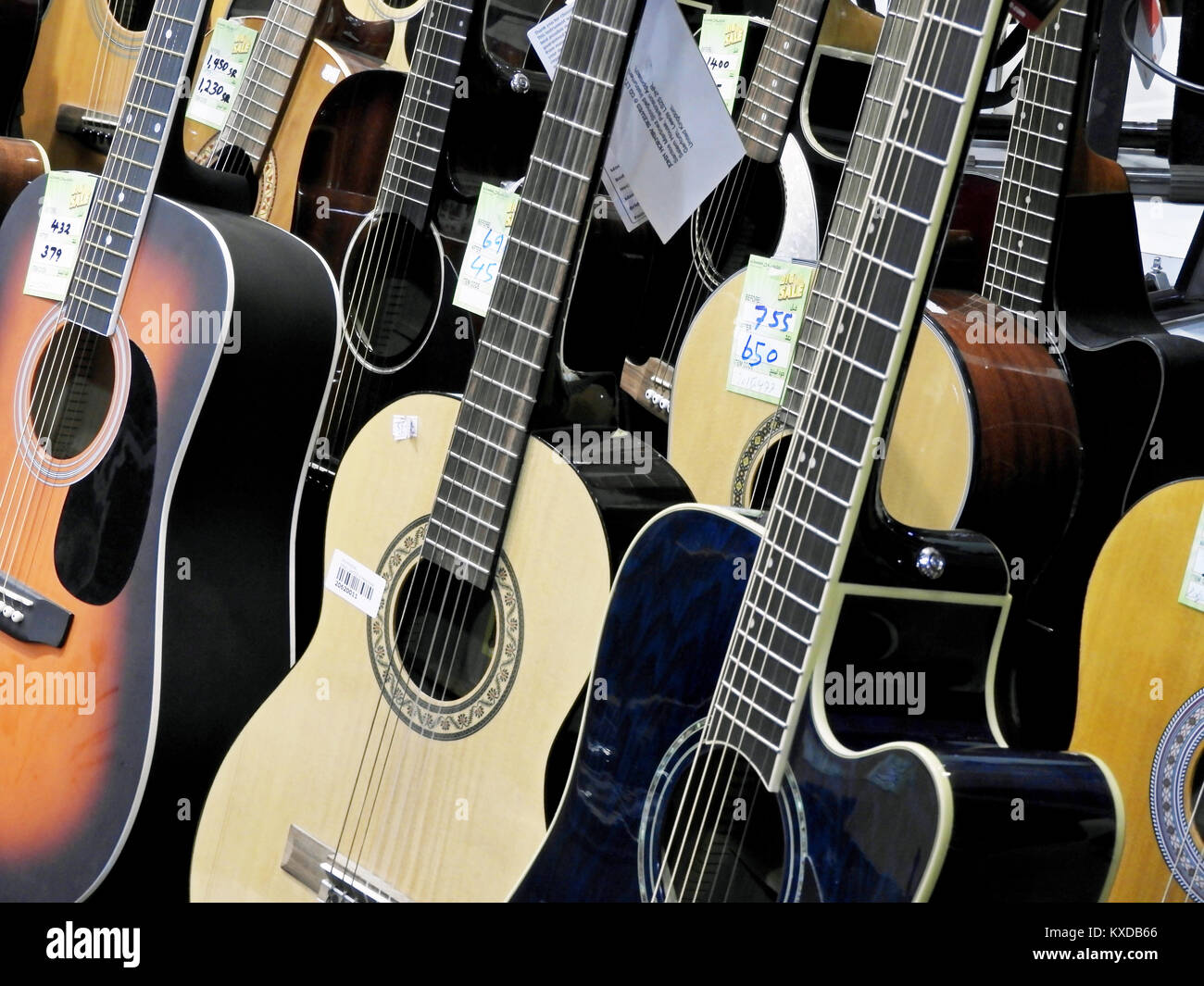 Buying musical instruments hi-res stock photography and images - Alamy
