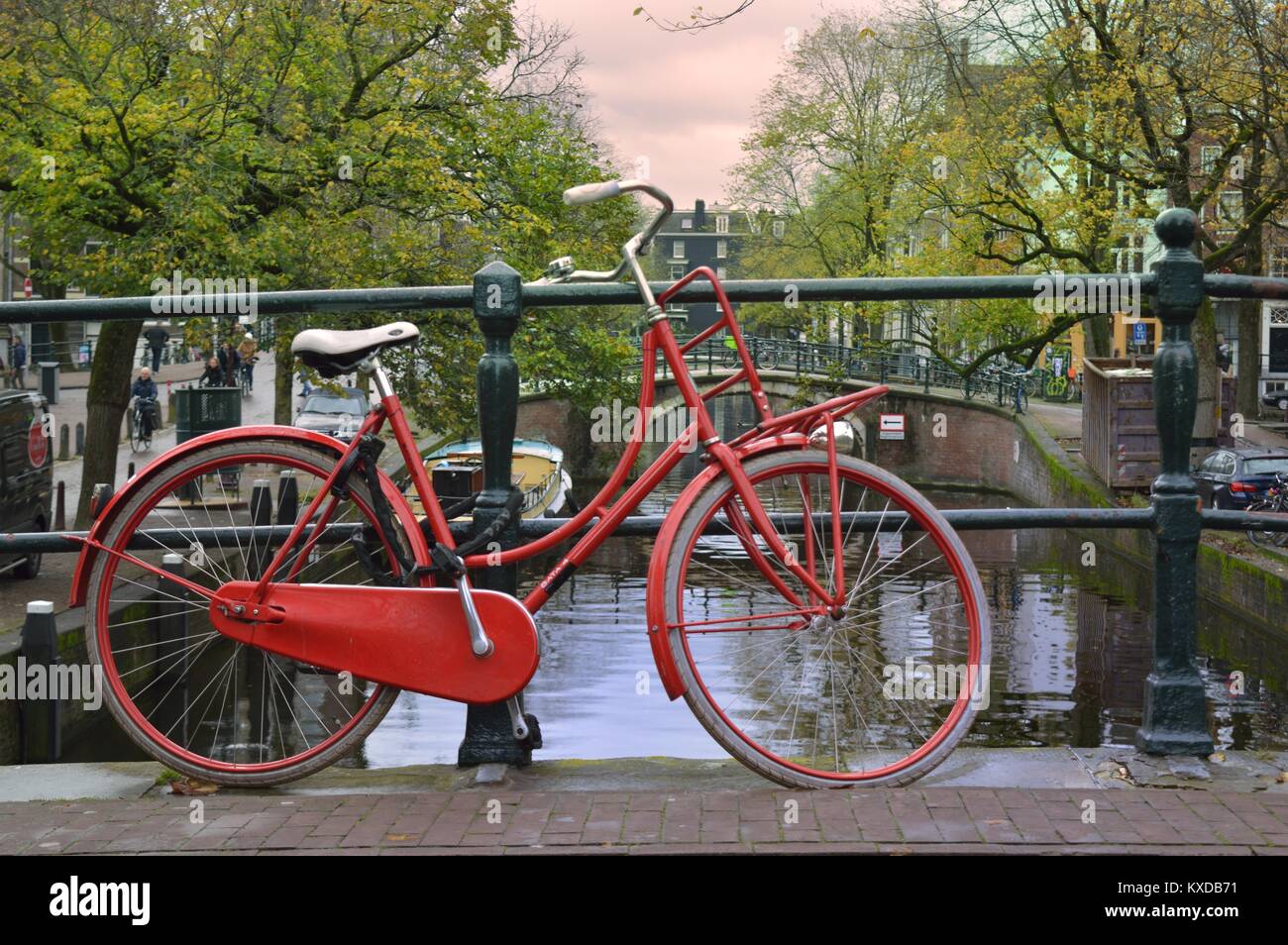 Red bike canal amsterdam hi-res stock photography and images - Alamy