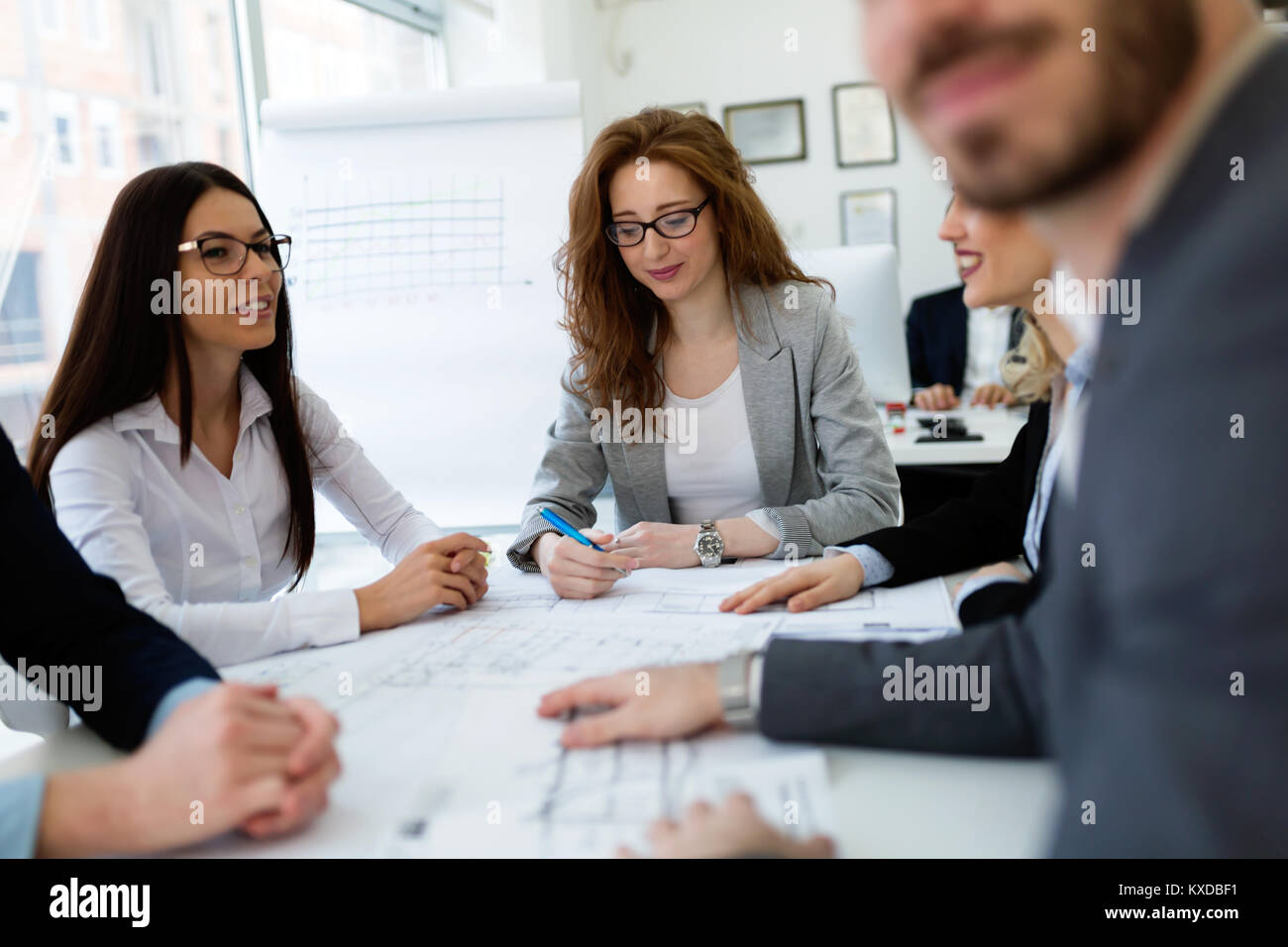 Group of architects working together on project Stock Photo - Alamy