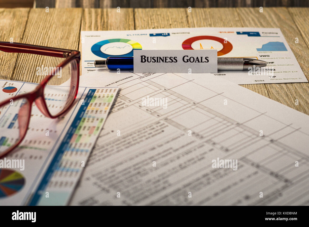 Business Goals investment and tax planning concept with charts and tax ...