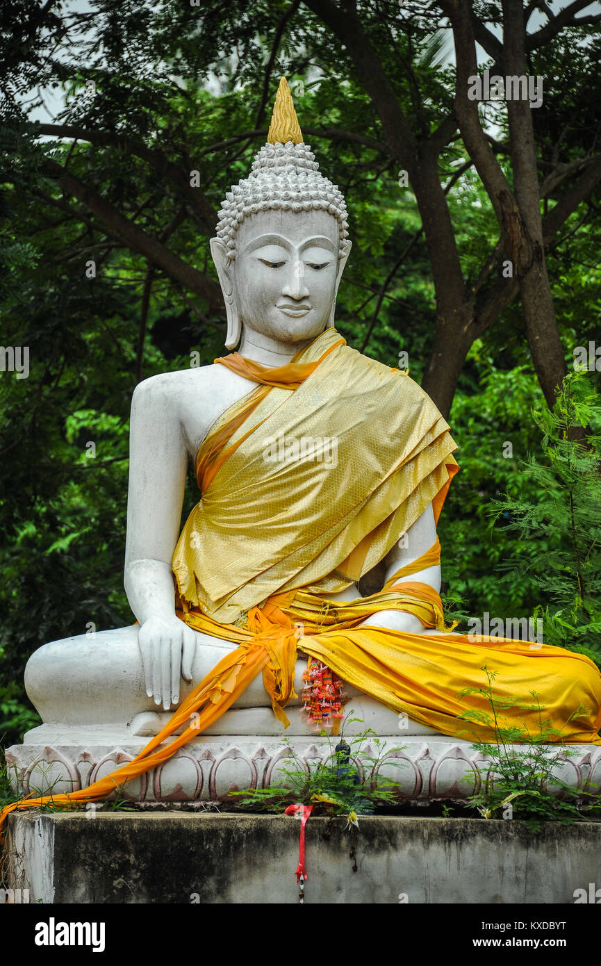 White Buddha Image in garden of Buddhist temple Stock Photo - Alamy