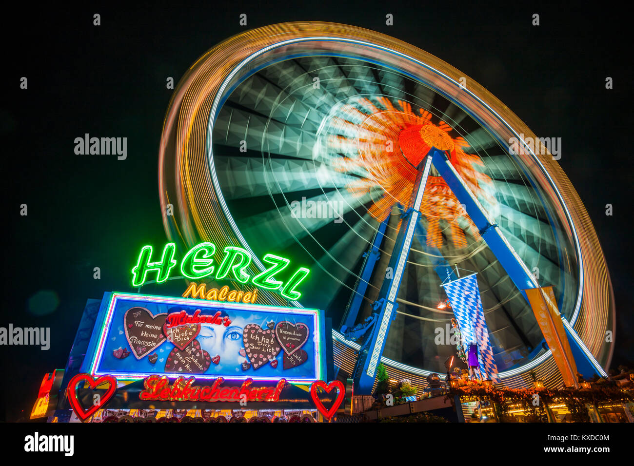 Gingerbread hearts stall with ferris wheel at night, Oktoberfest ...