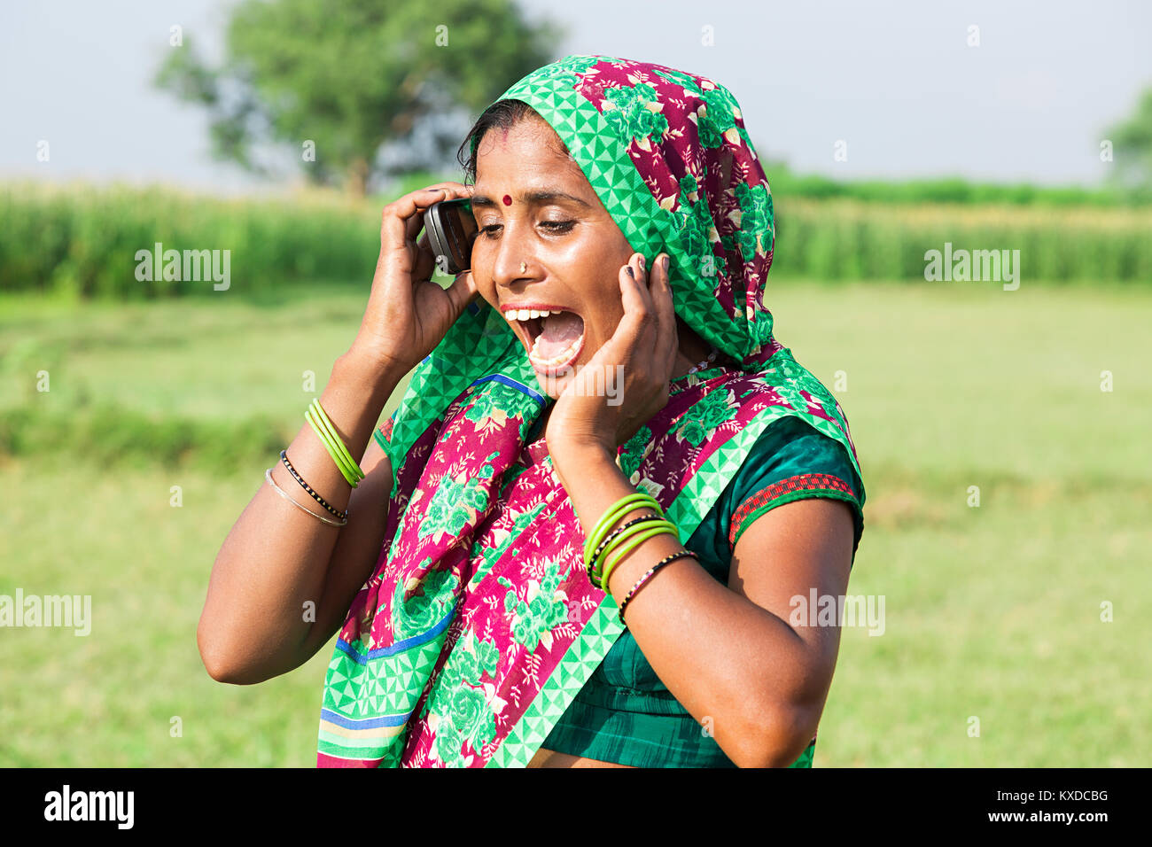 1 Indian Rural Farmer Woman Talking Phone Shouting Goodnews Cheerful ...