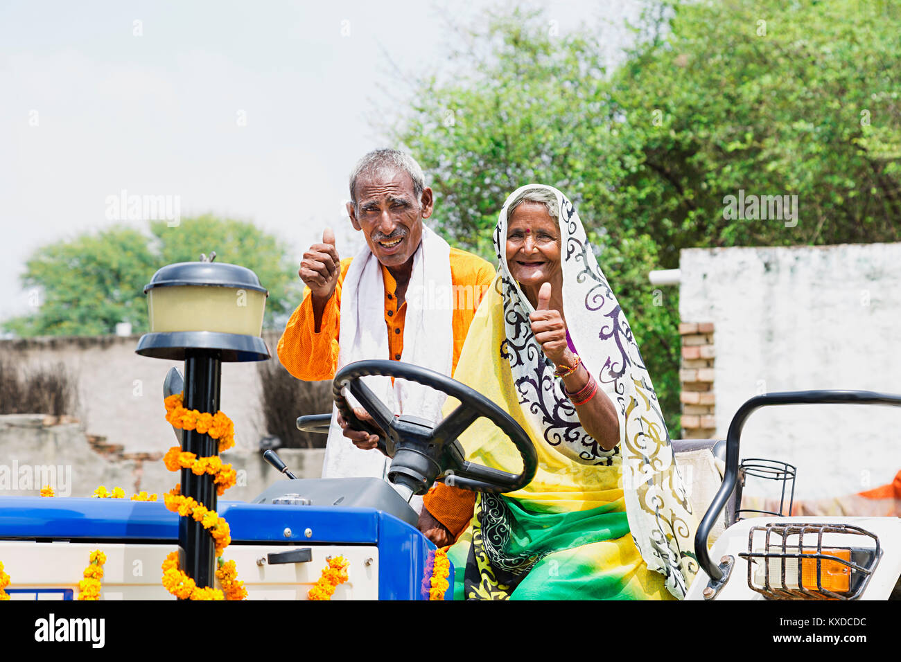 2 Indian Rural Farmer Old Couple Ride Tractor Showing Thumbsup Stock ...
