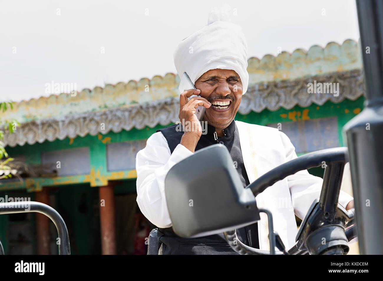 1 Farmer Man driving tractor talking Mobile phone Village Haryana Stock ...