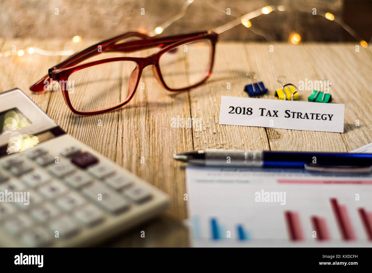 2018 Tax Strategy finance concept with charts and graphs and calculator ...