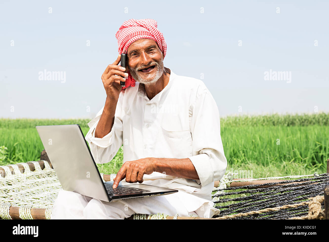 1 Indian Rural Farmer Laptop Working And Talking Phone Farm Stock Photo ...