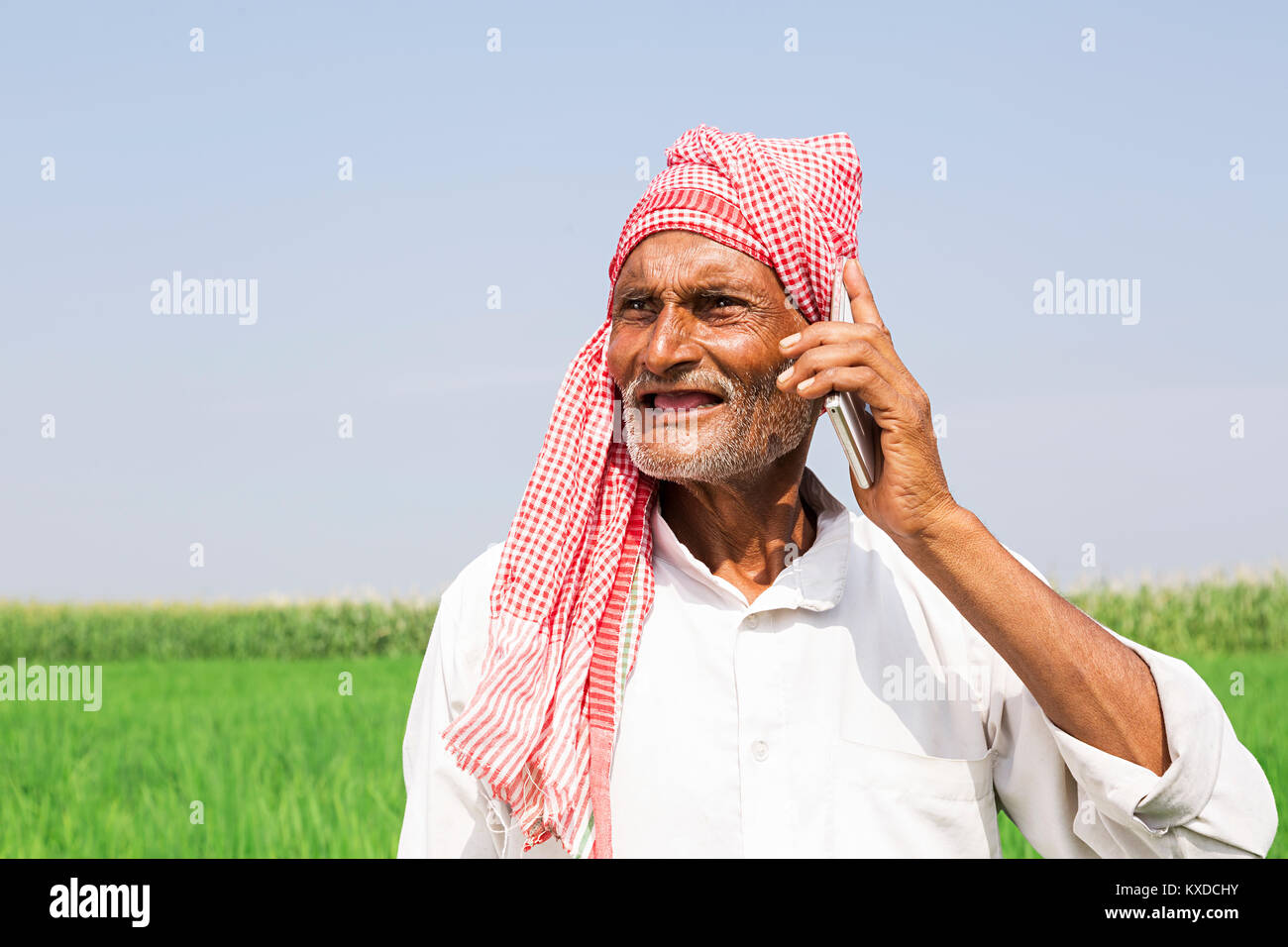 Indian old man talking phone hi-res stock photography and images - Alamy