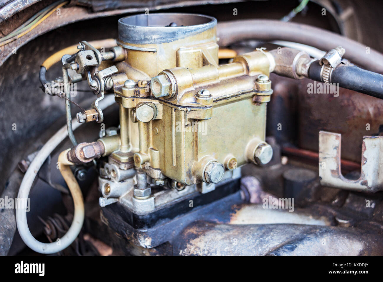 Vintage carb on the old engine Stock Photo - Alamy