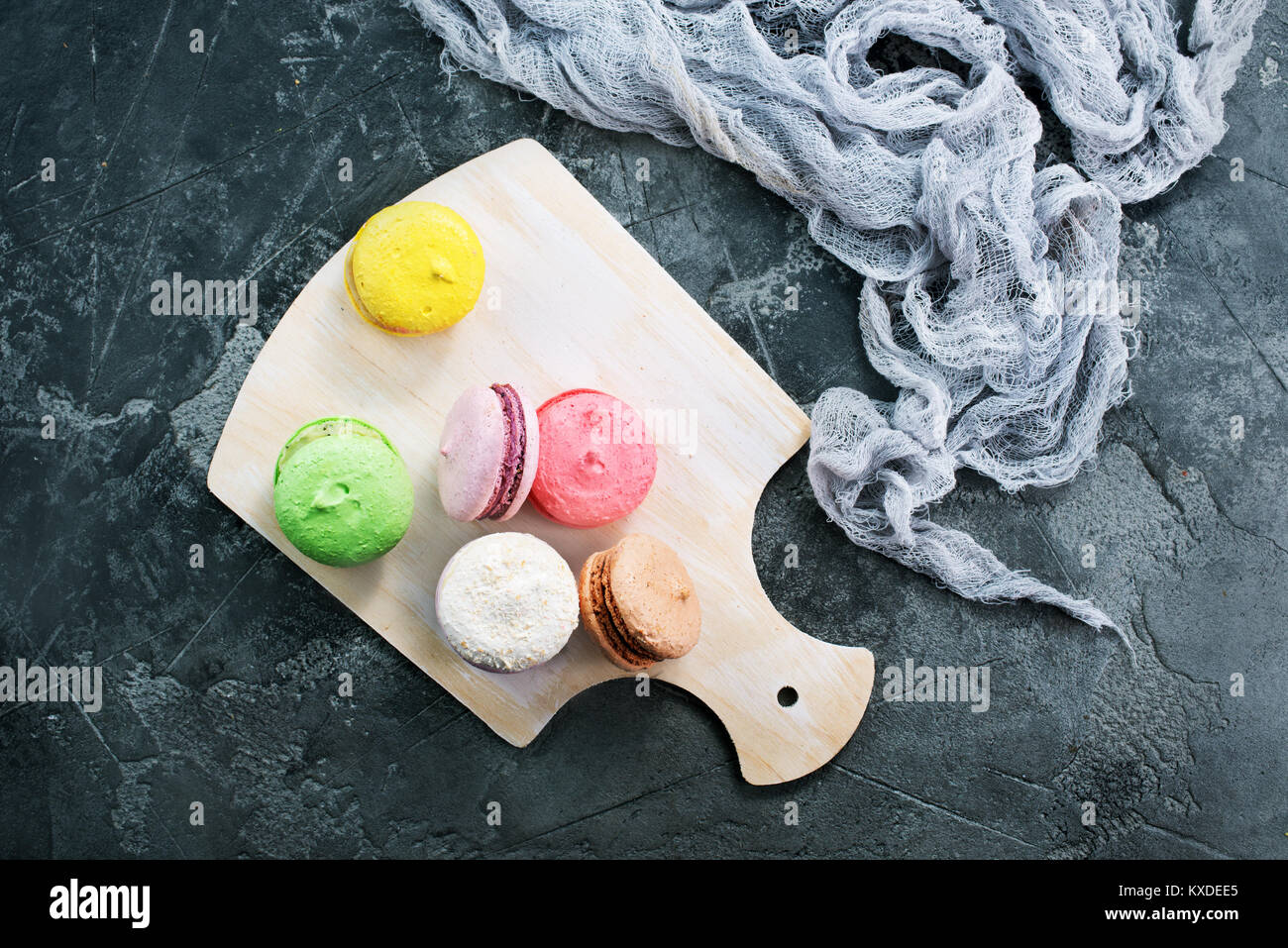 color macaroons on board and on a table Stock Photo - Alamy
