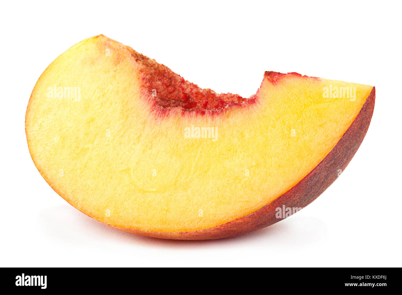 Peach fruit slice closeup isolated on white background Stock Photo - Alamy