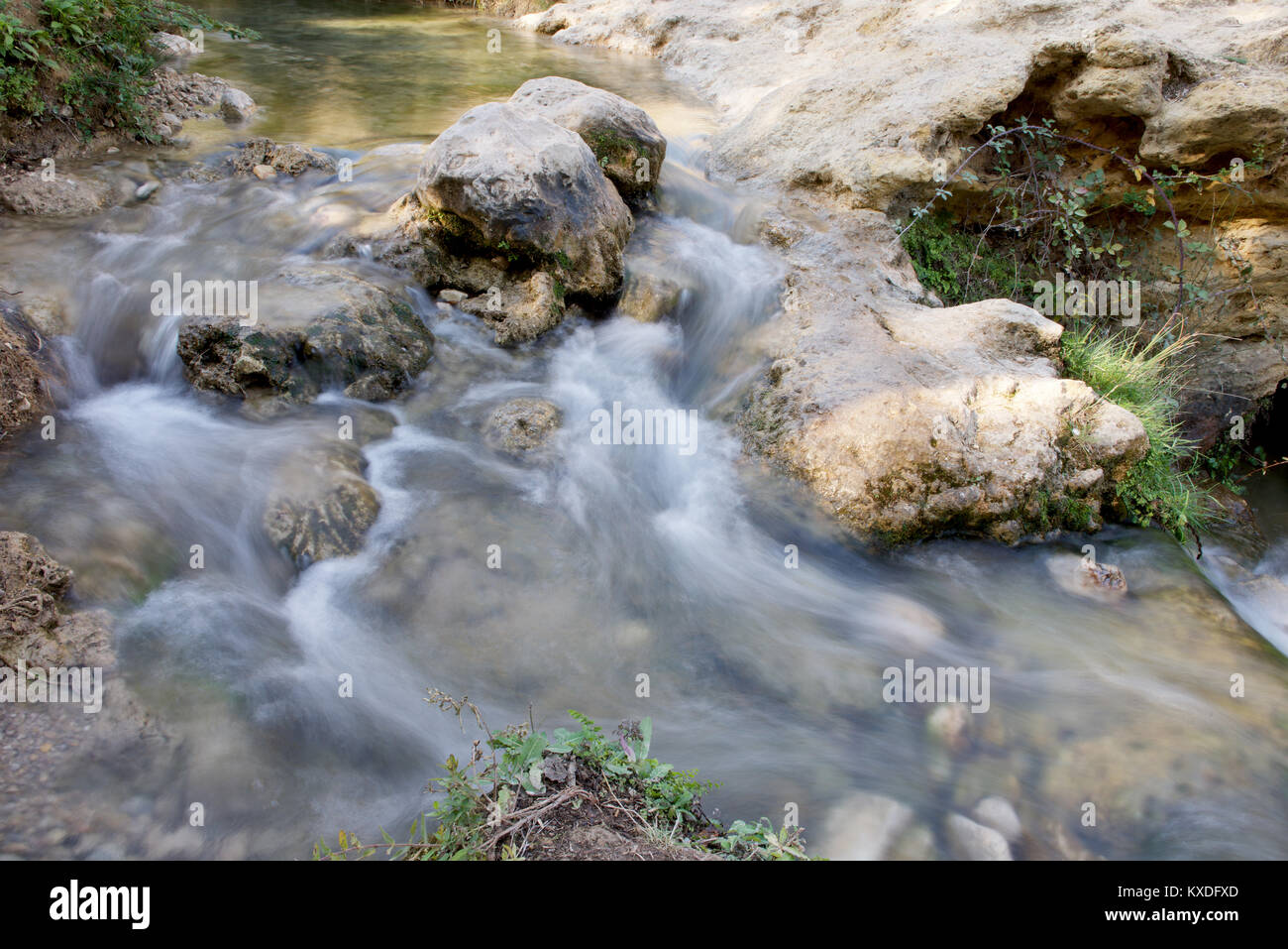 Motion blur of a river flowing over rocks Stock Photo - Alamy
