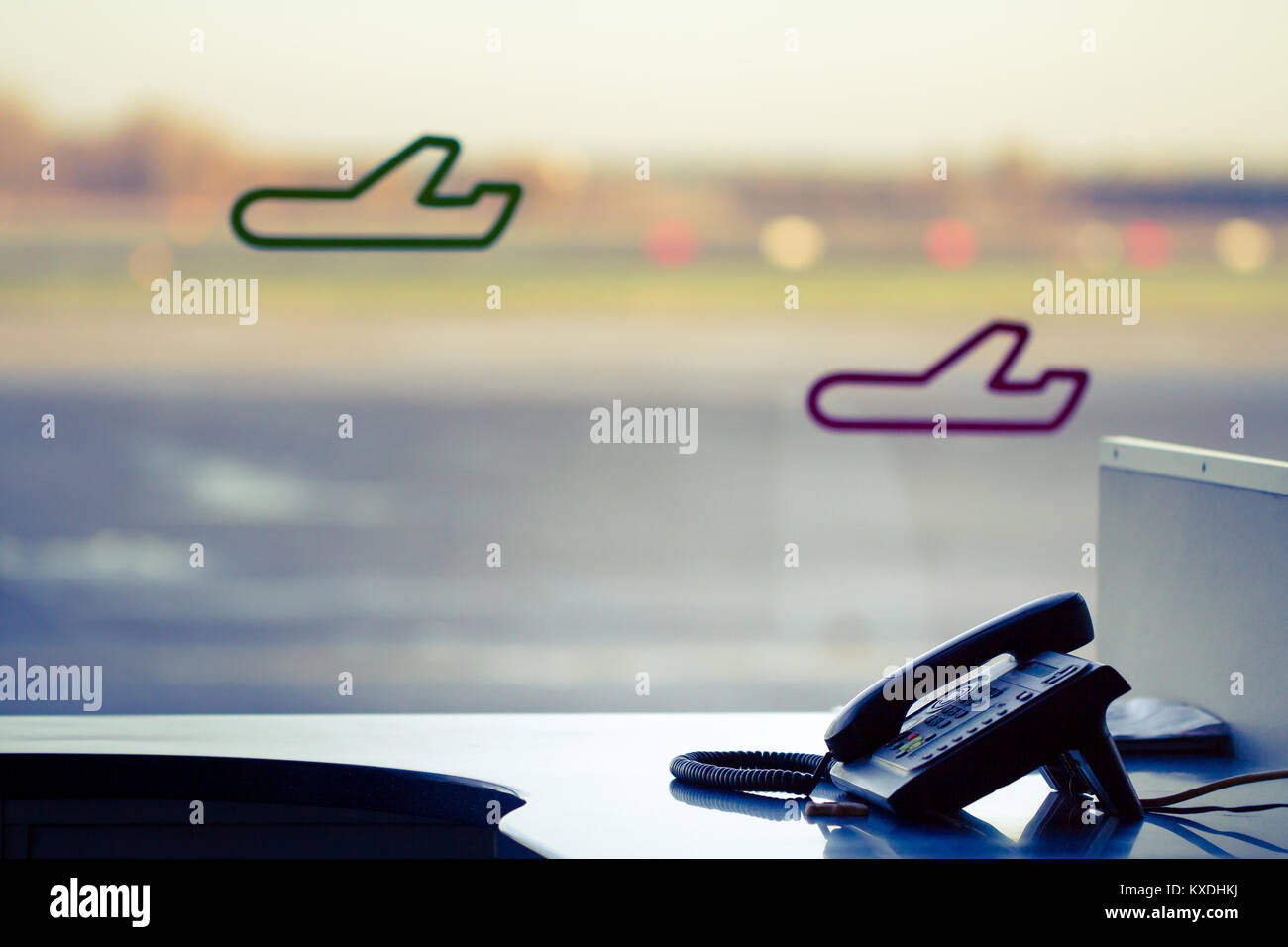 Airplane symbol stickers on glass window on the airport with telephone ...