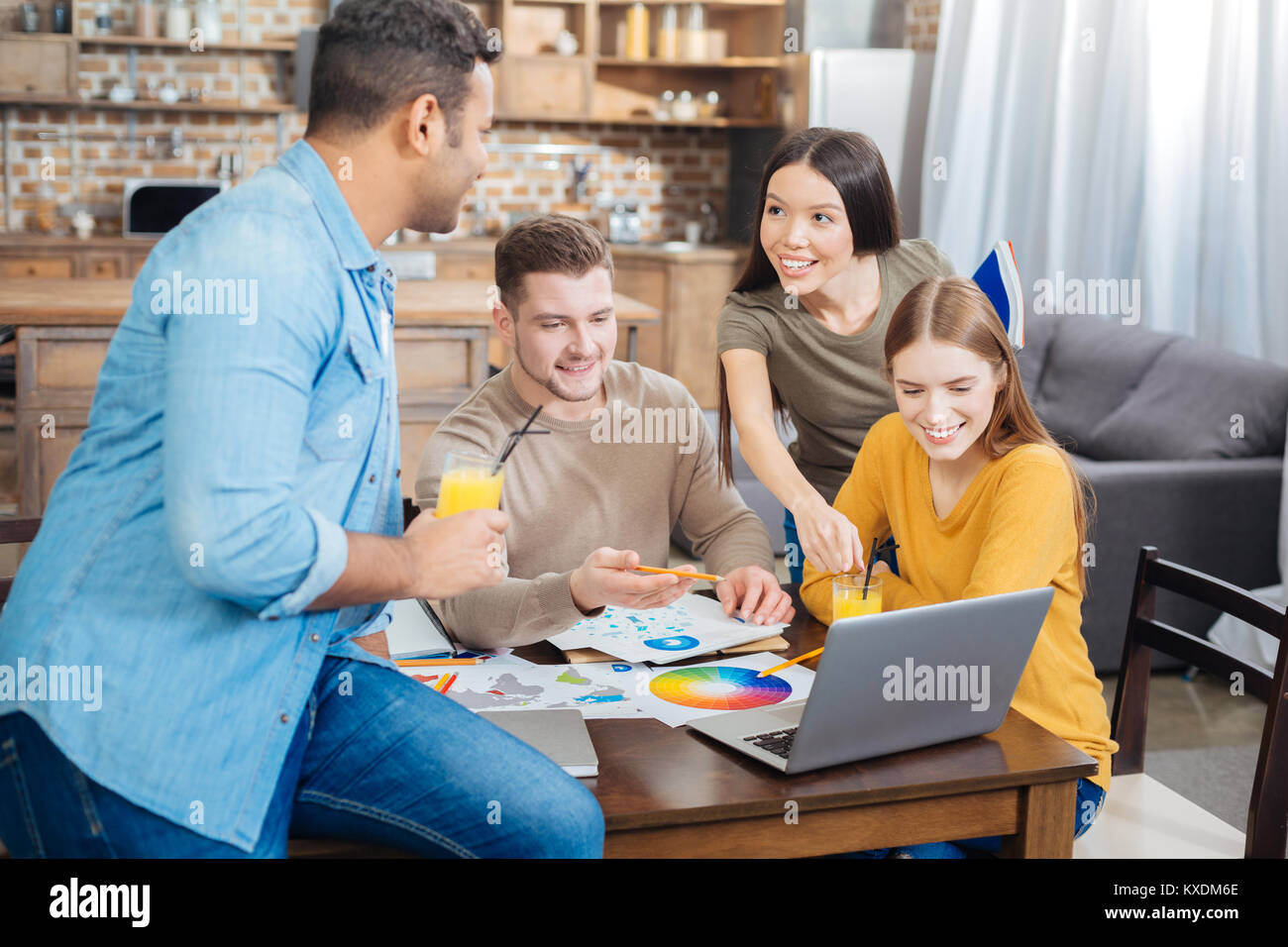 Polite student pointing to the screen Stock Photo - Alamy