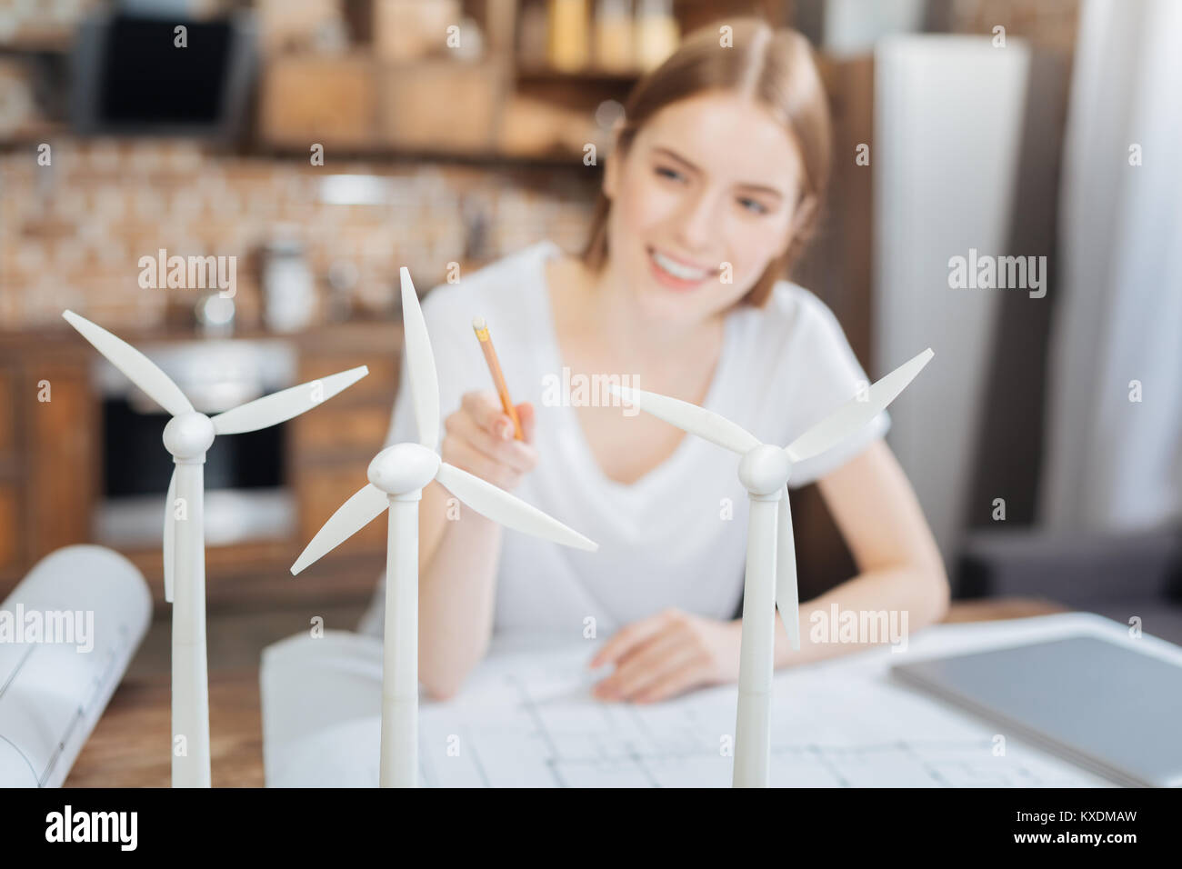 Smart experienced engineer smiling while measuring tiny turbines Stock ...