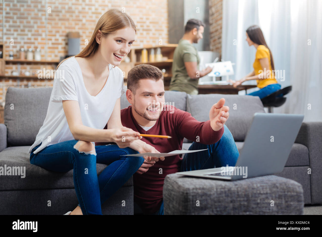 Happy student pointing at the positive changes in a new project Stock ...