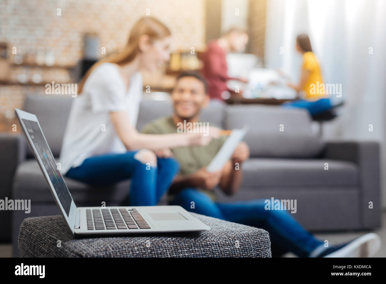 modern laptop standing next to students Stock Photo - Alamy