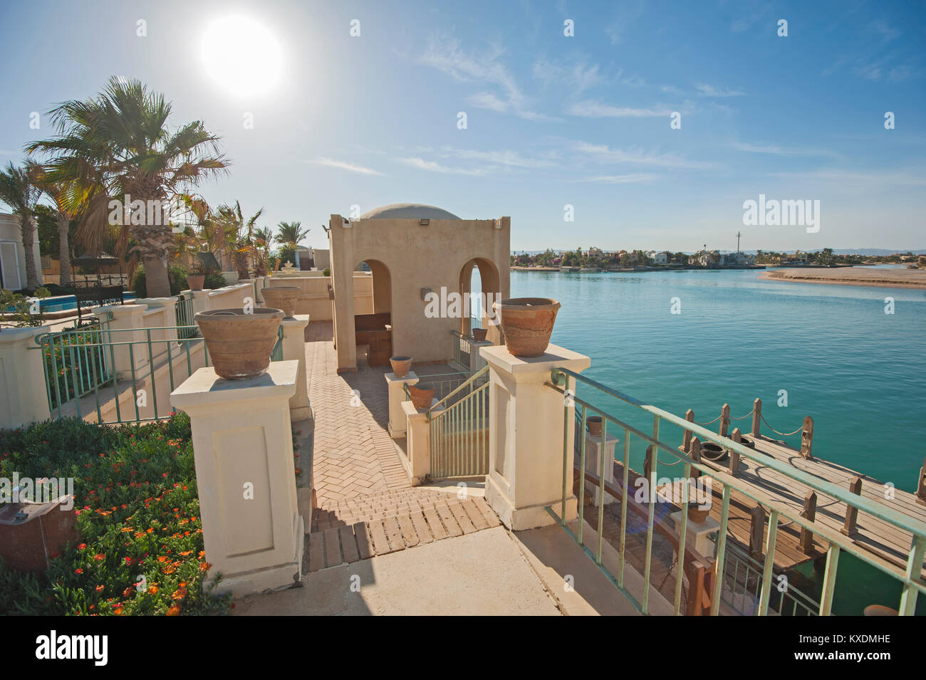 Exterior outdoor waterfront terrace area of luxury tropical holiday ...