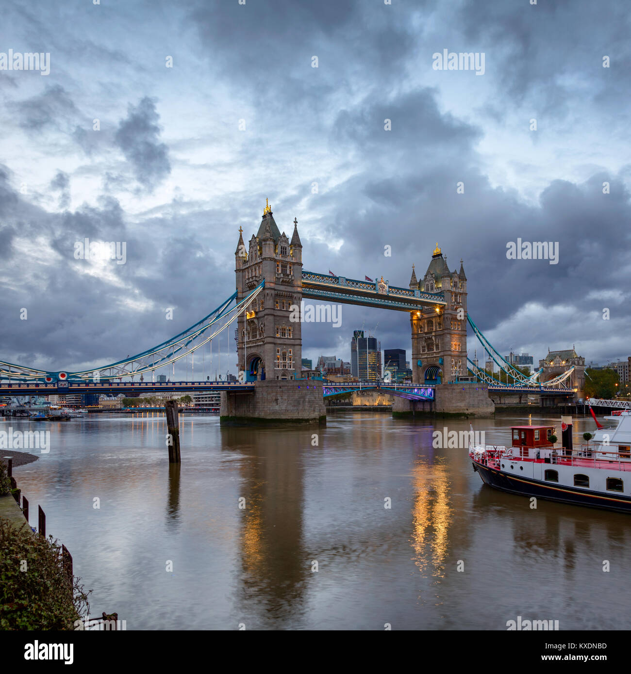 London cityscape with illuminated Tower Bridge over the River Thames at ...