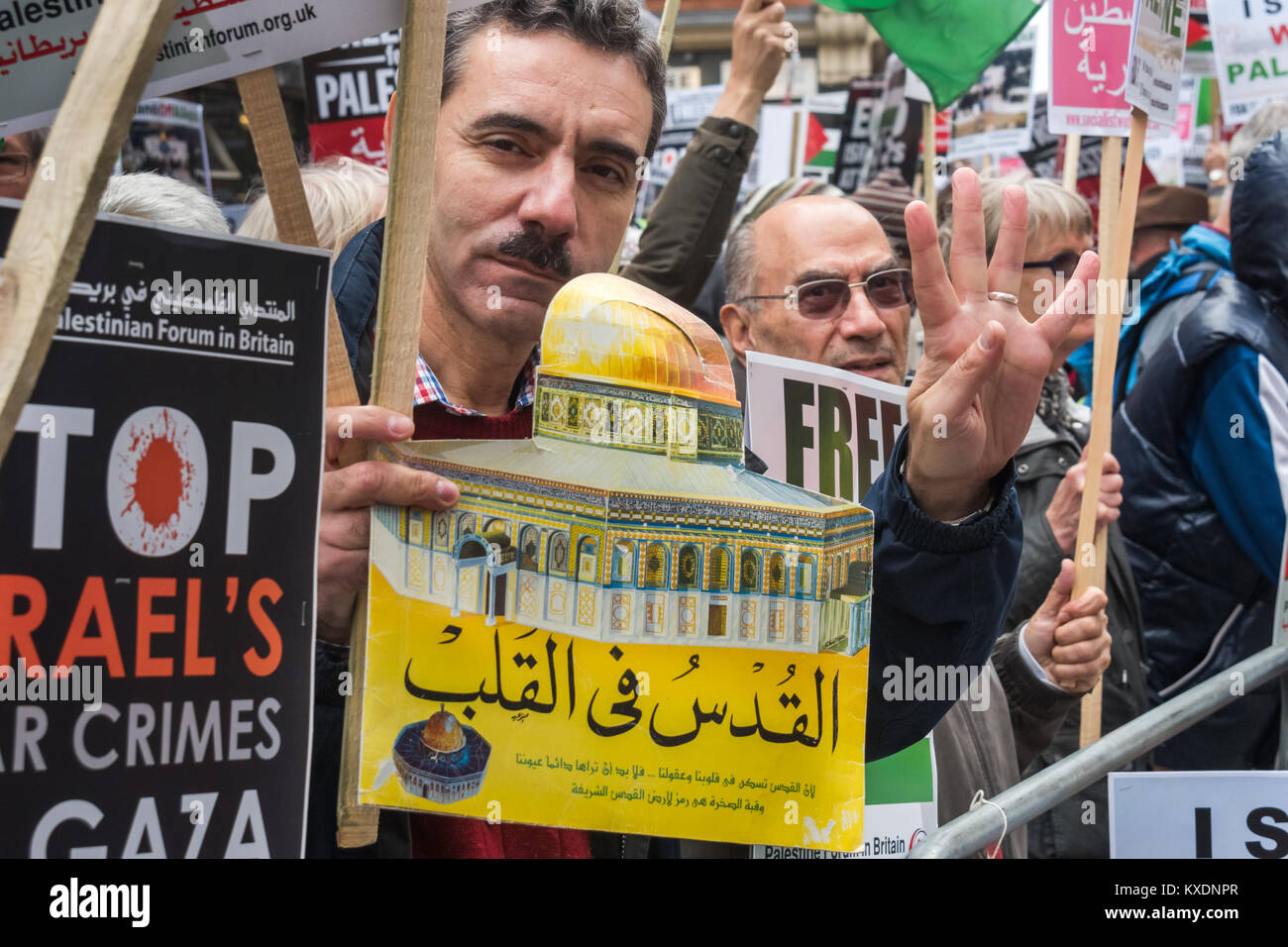 A man holds an image of the Al Aqsa mosque in Jerusalem at the protest ...