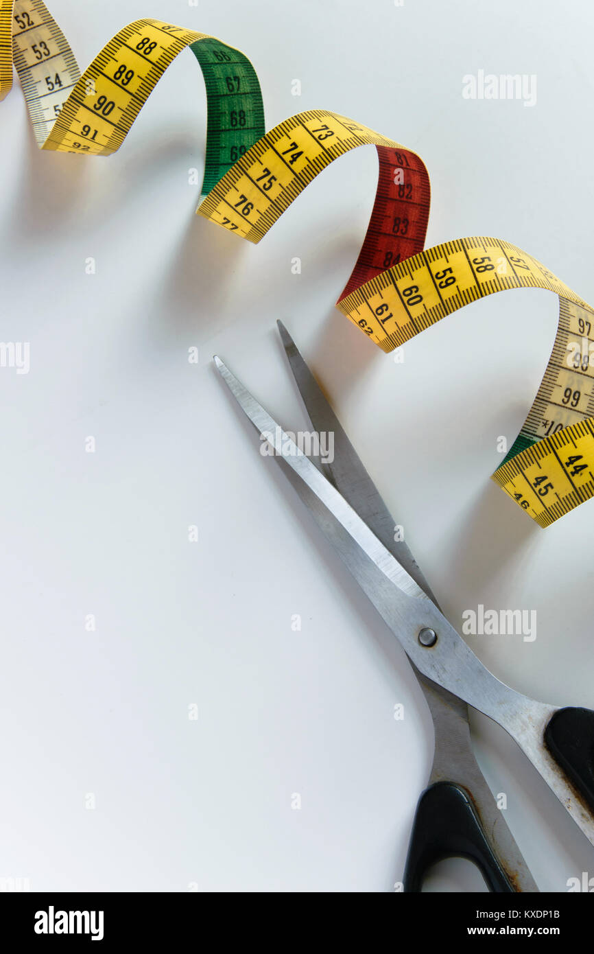 Isolated sewing meter and scissors on white background with space for ...